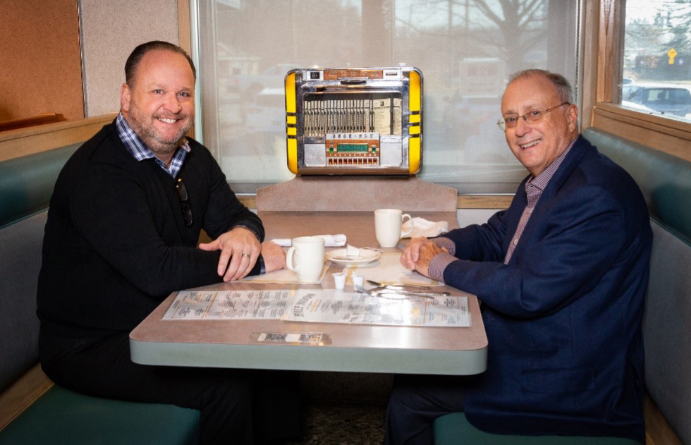 Dr. John Bennett and Dan Pickett having coffee